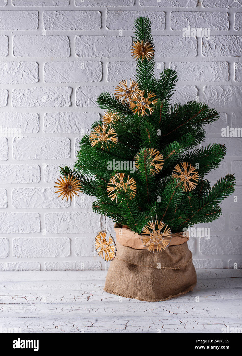 Christmas tree with decor from straw Stock Photo - Alamy