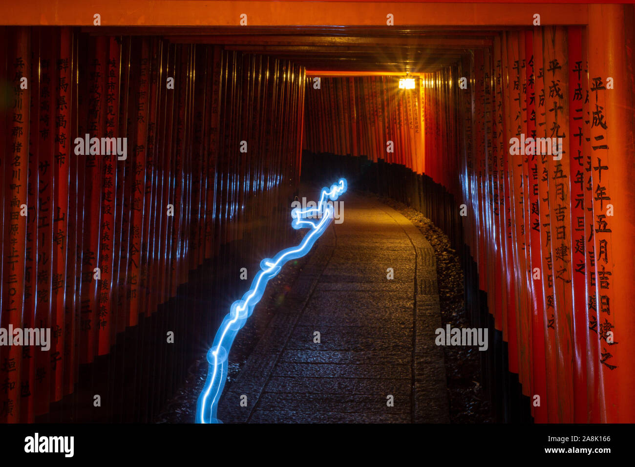 Red Torii gates in Fushimi Inari shrine in Kyoto, Japan at night Stock ...