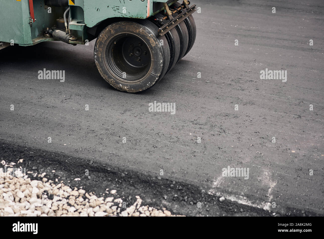 Asphalt Compactors is carrying out road repair work. Laying new asphalt ...