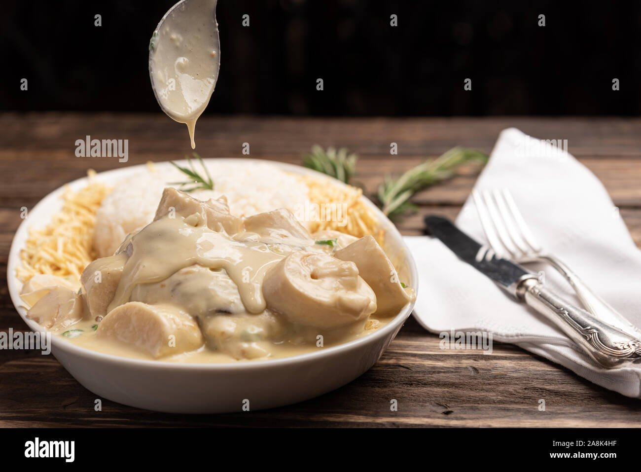 Homemade beef with bechamel, palm and cheese sauce on wooden background ...