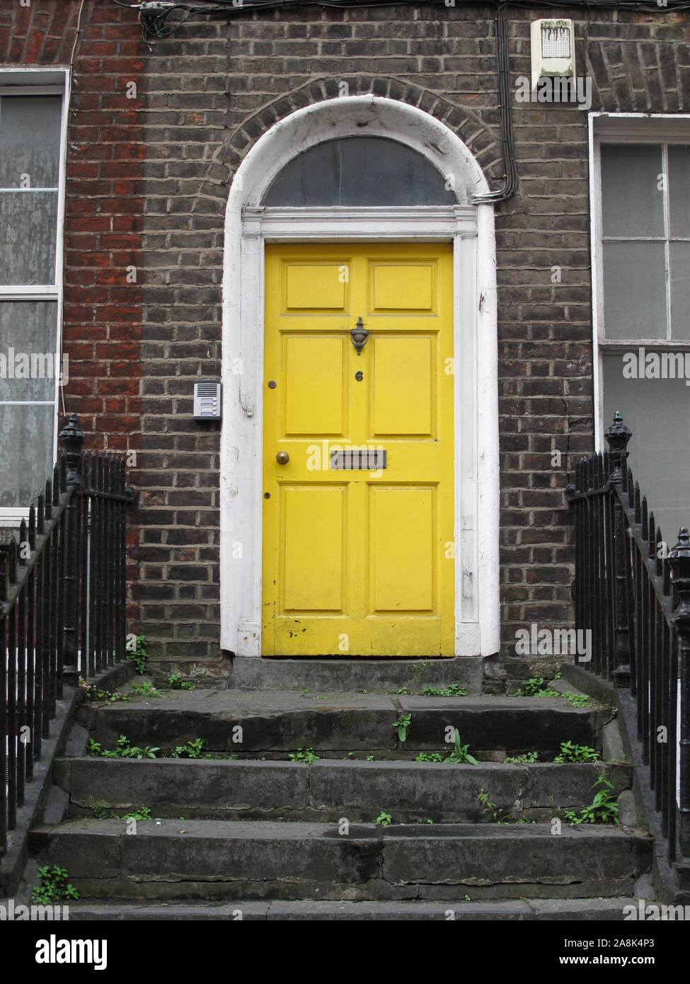 Lovely yellow door of a building in Georgian style in Limerick, Ireland ...