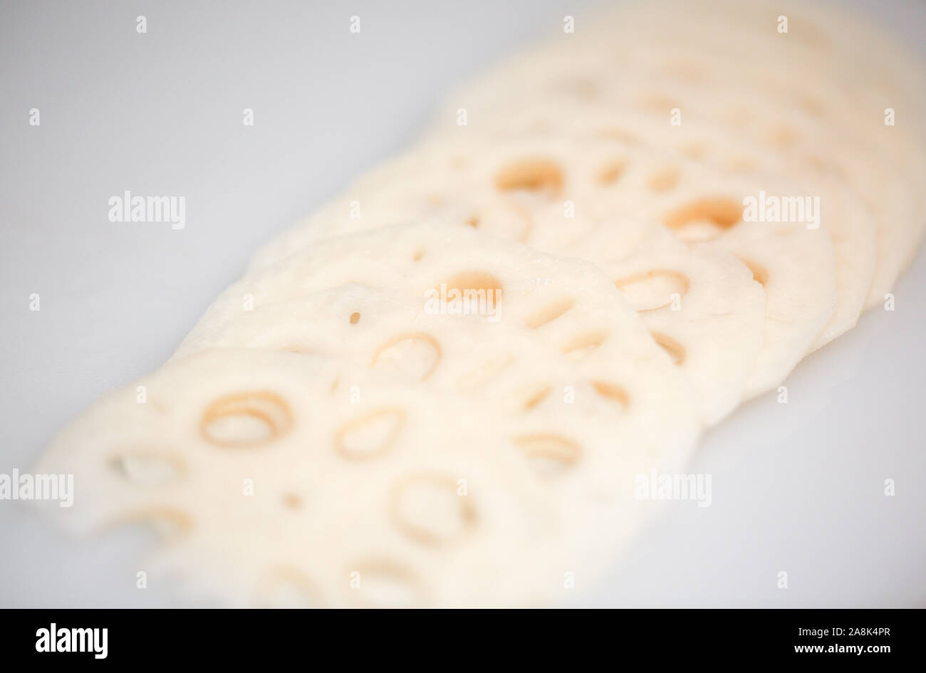 Slices of fresh lotus root on white background - isolated (Asian ...