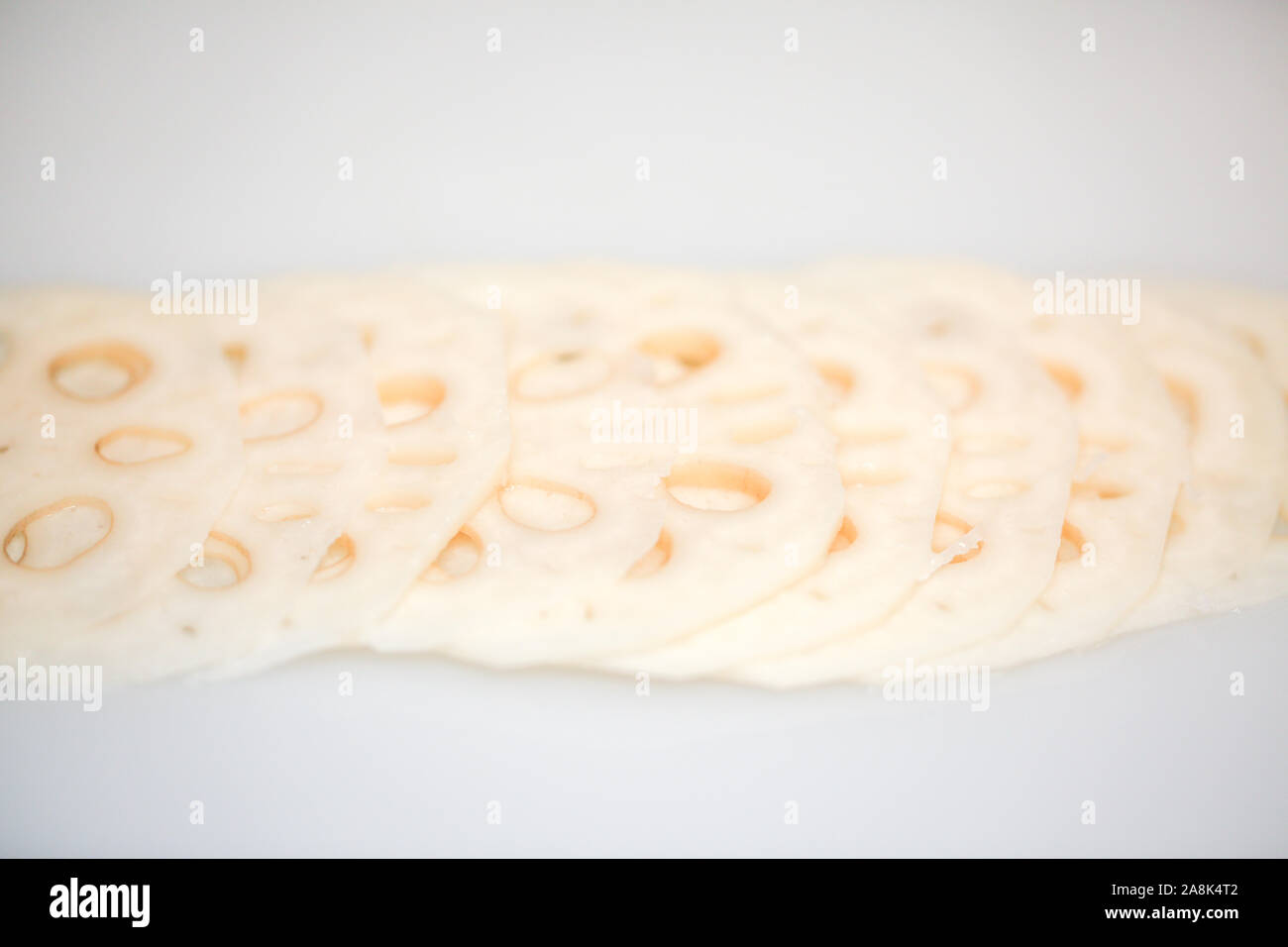 Slices of fresh lotus root on white background - isolated (Asian ...