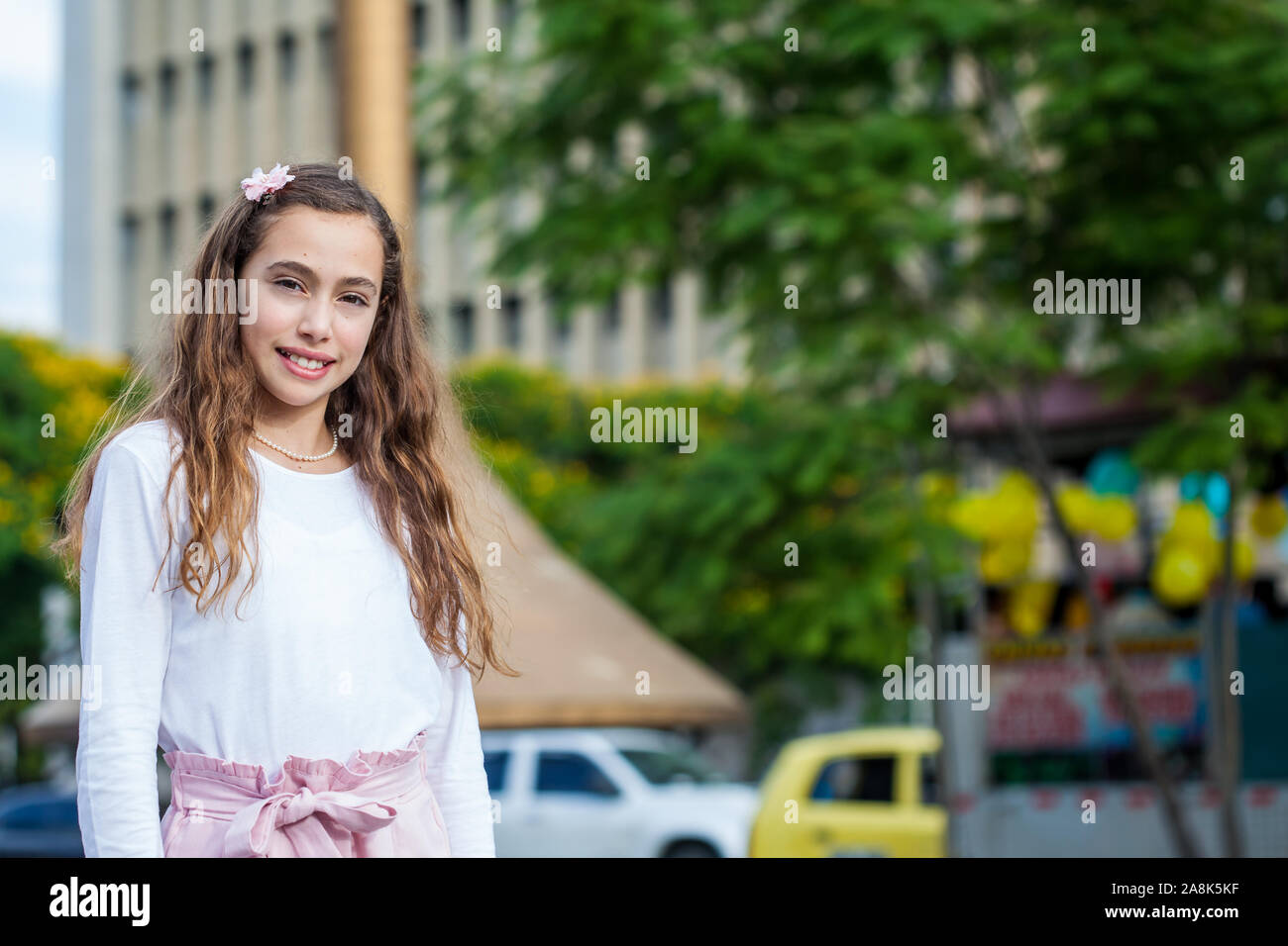 Beautiful young girl at the Jairo Varela Square in the city of Cali in ...