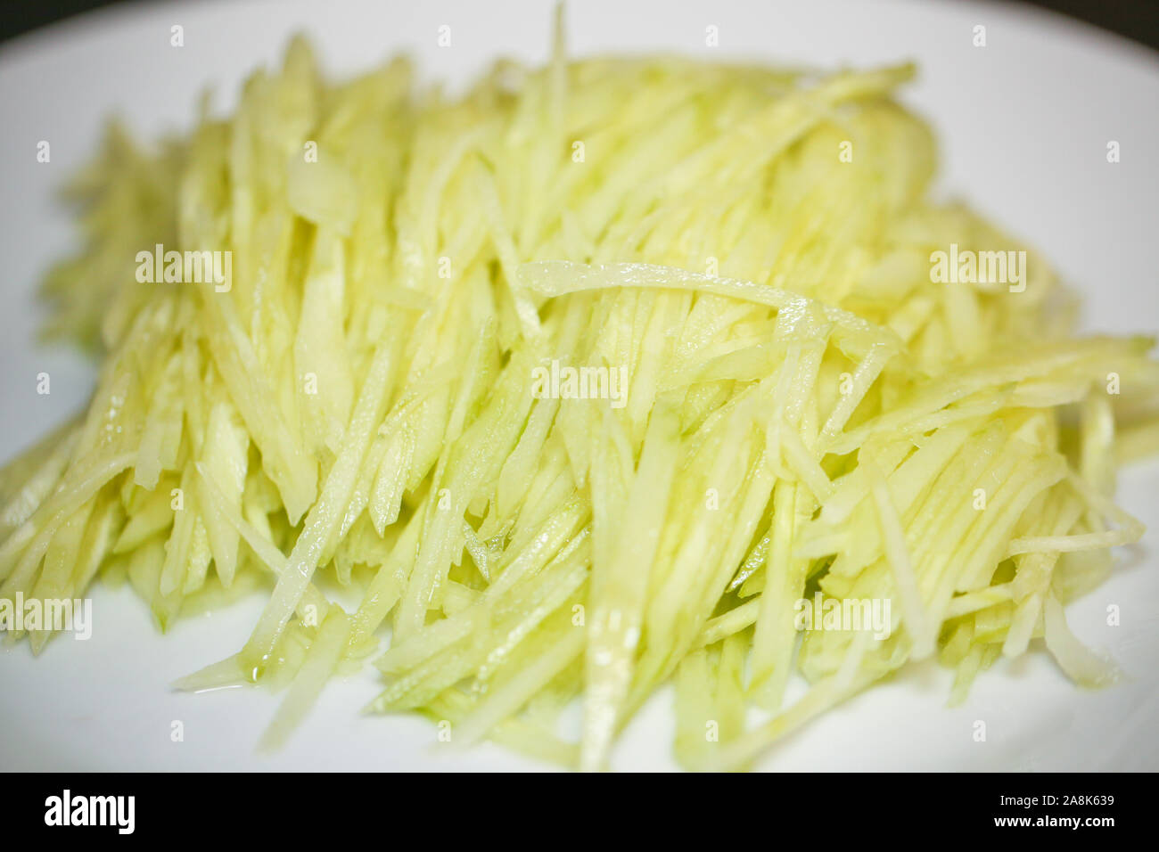 Cucumber cut into small strips for cooking cold dishes. - Image Stock ...