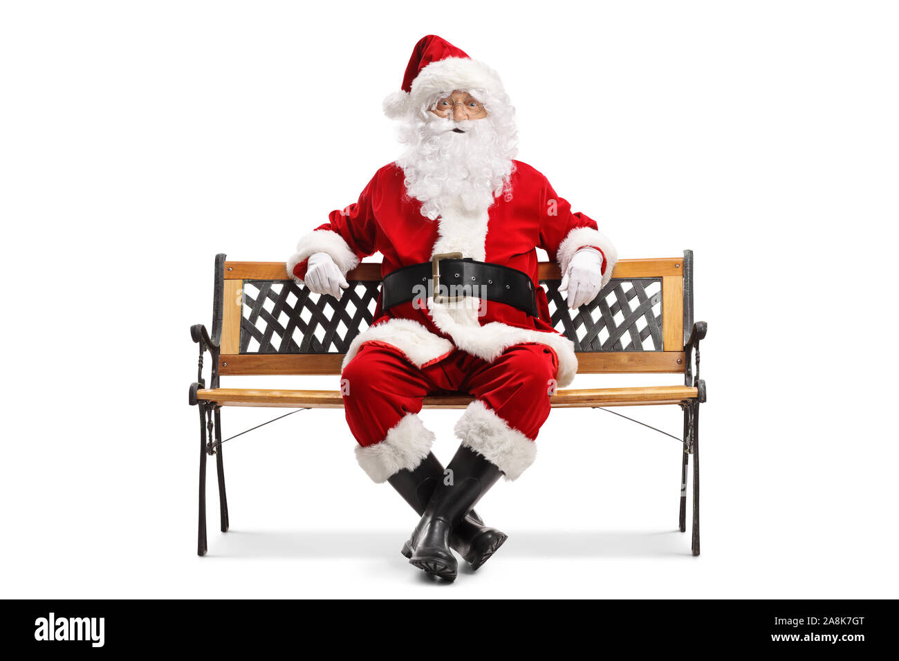 Full length portrait of Santa Claus resting on a bench isolated on ...