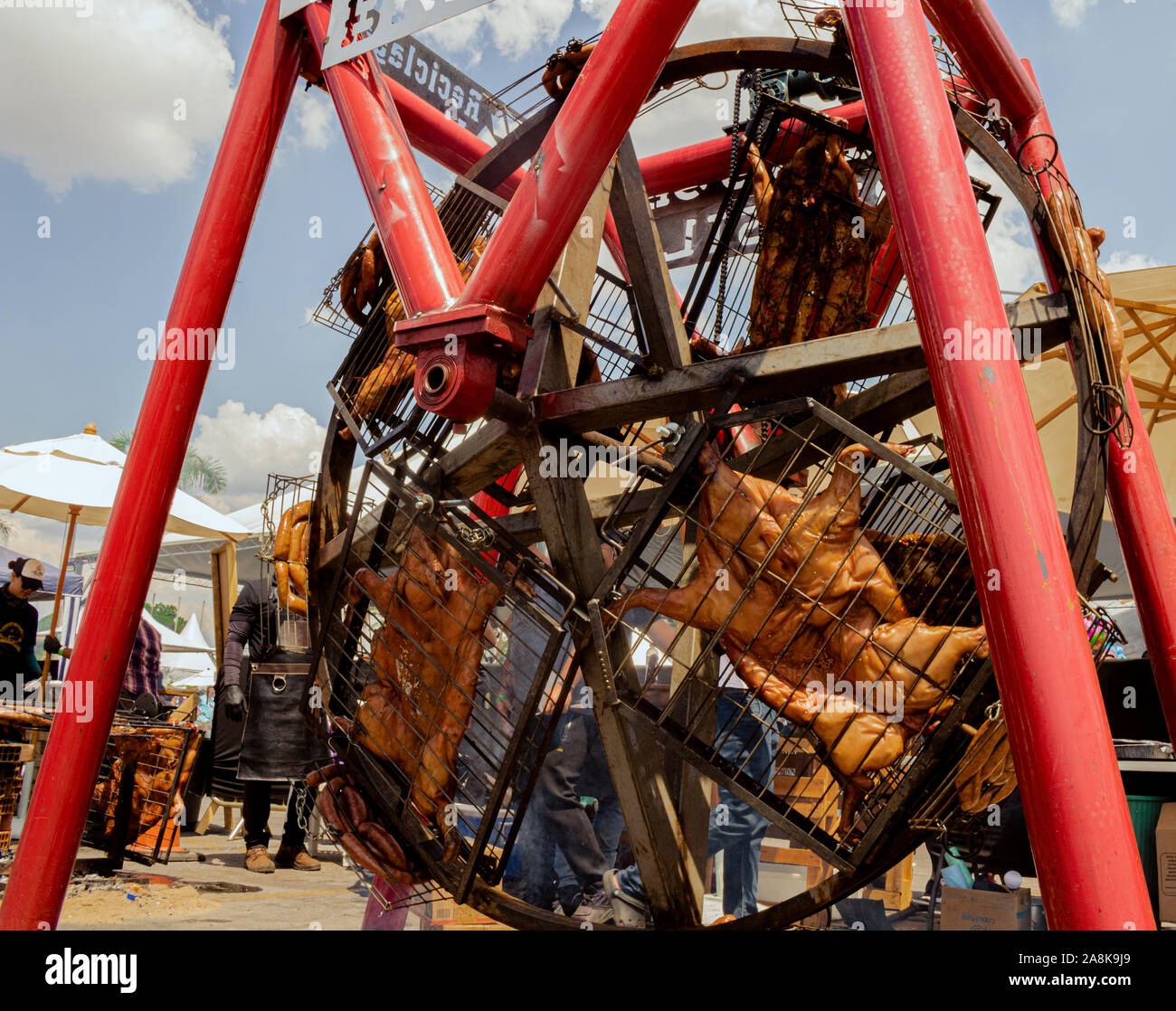 a red ferris wheel of pigs and meats Stock Photo - Alamy