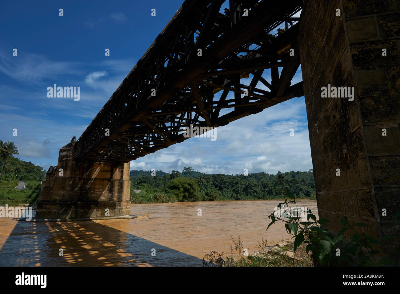 The KTMB steel railroad bridge over the muddy river Galas near DaBong ...