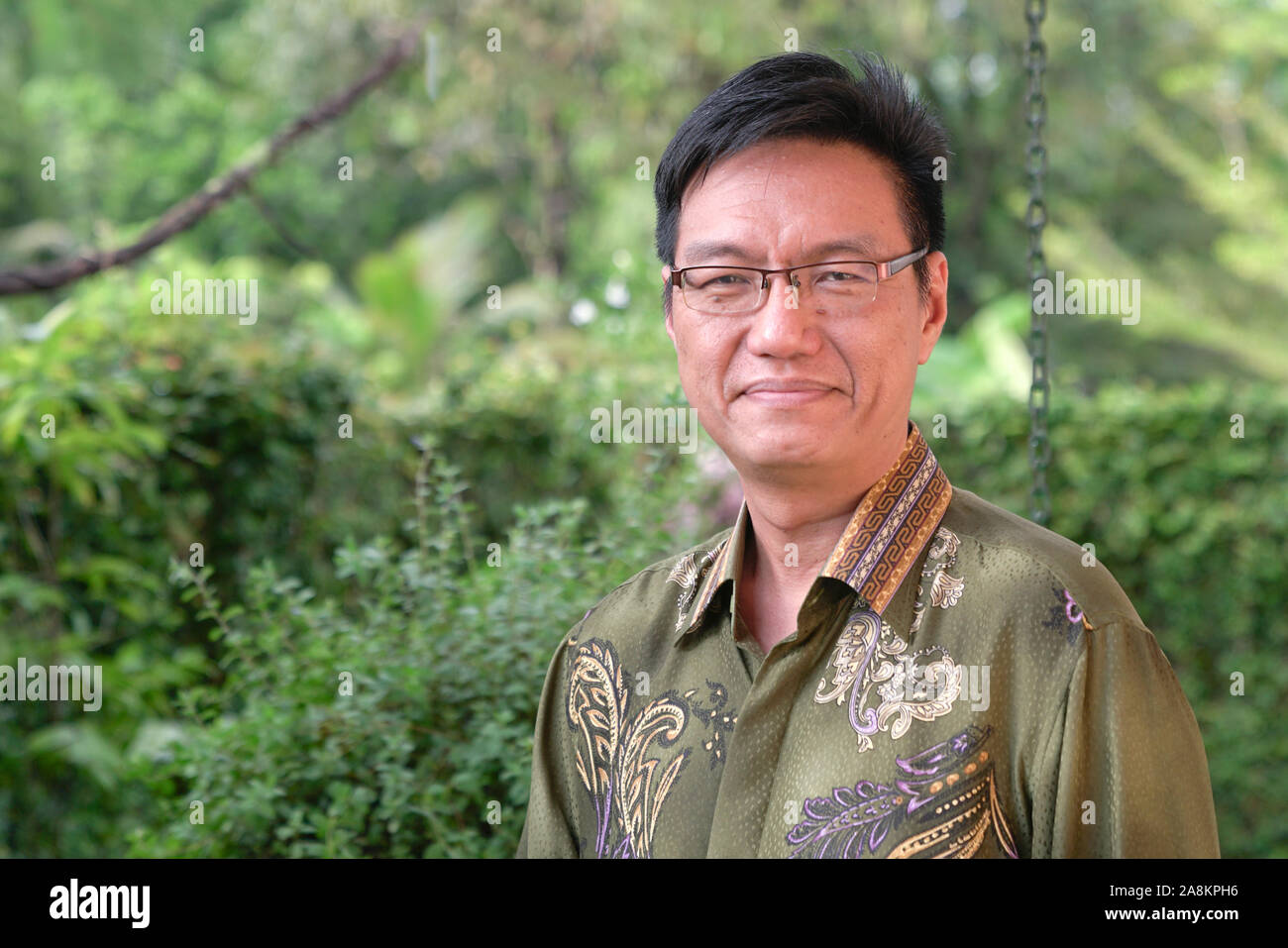 Portrait of an Asian Chinese successful businessman in formal ...