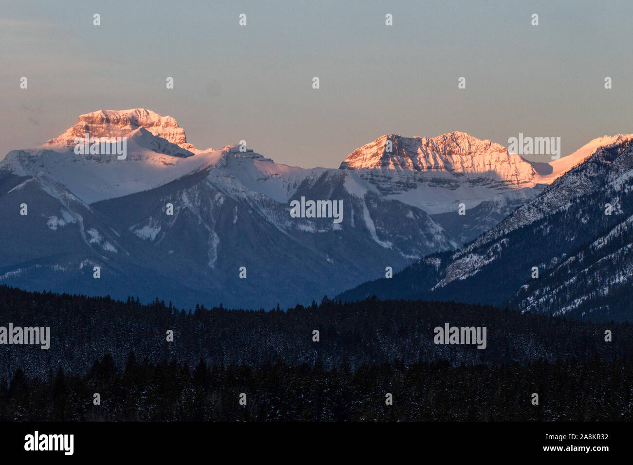 Morning Golden Hour Over Snowy Mountain Tops in Banff Stock Photo - Alamy