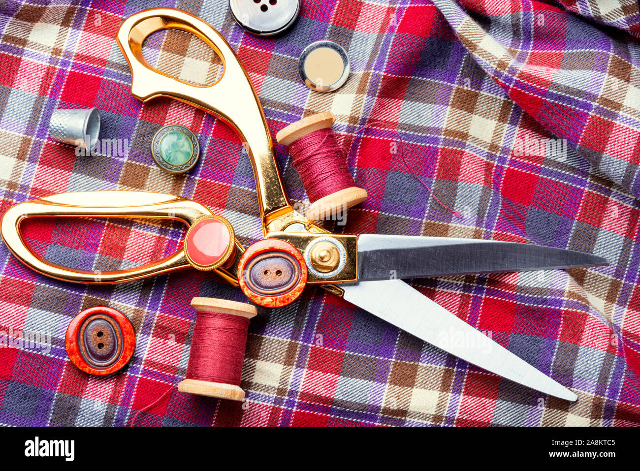 Sewing tools, scissors, buttons and threads on fabric Stock Photo - Alamy
