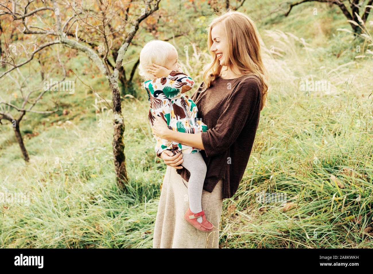 mom holds baby outside Stock Photo - Alamy