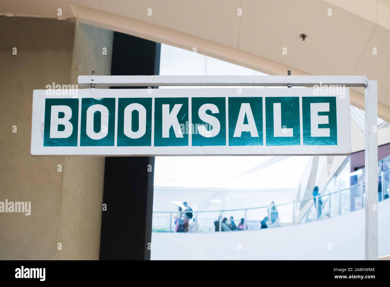 Book sale on a green background Stock Photo - Alamy