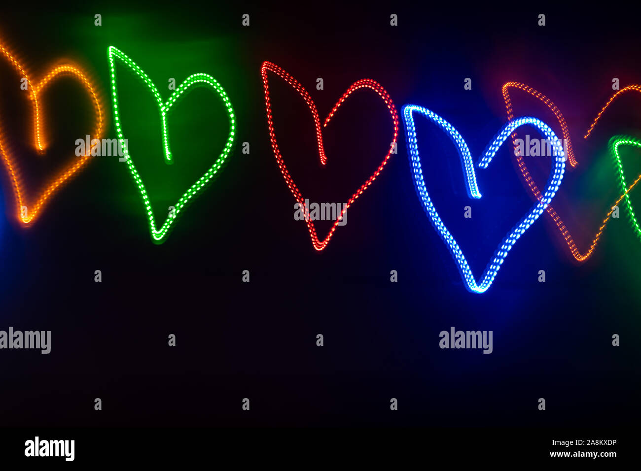 Blue neon glowing laser hearts hi-res stock photography and images - Alamy