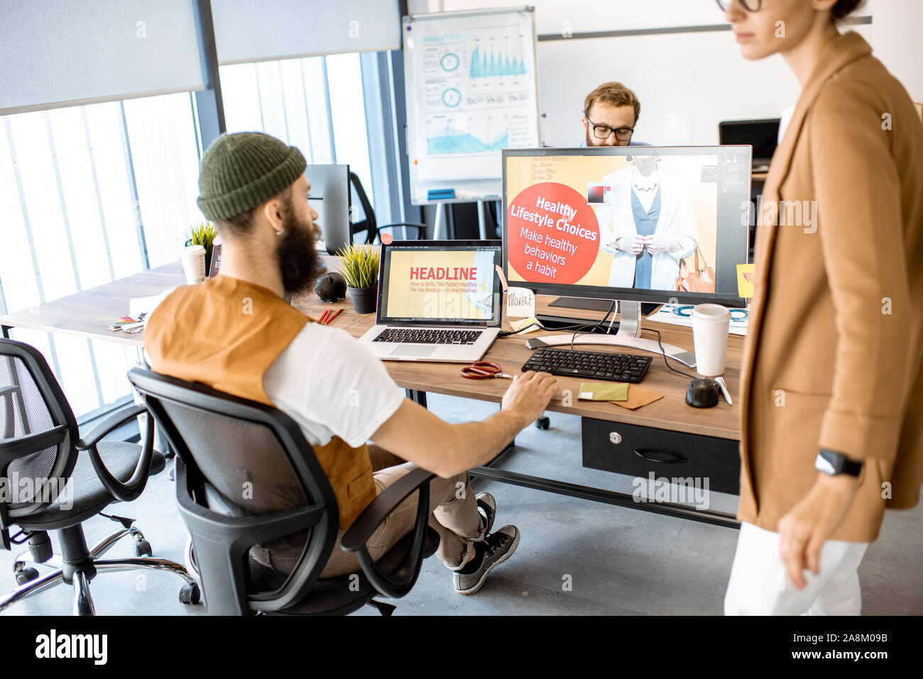 Group of diverse creative people working as a web designers in the ...