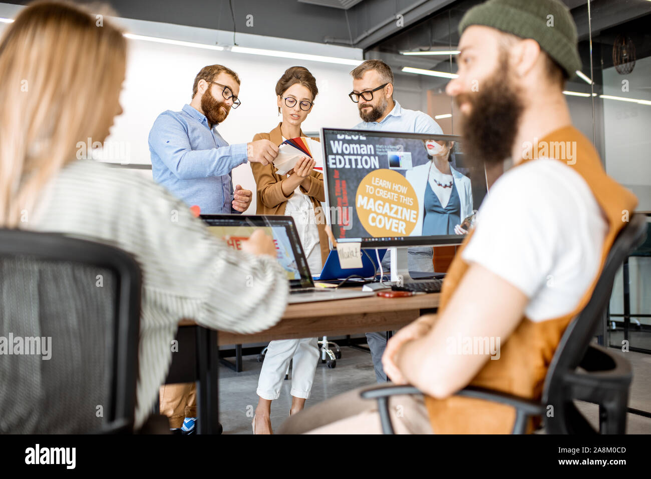 Group of diverse creative people working as a web designers in the ...