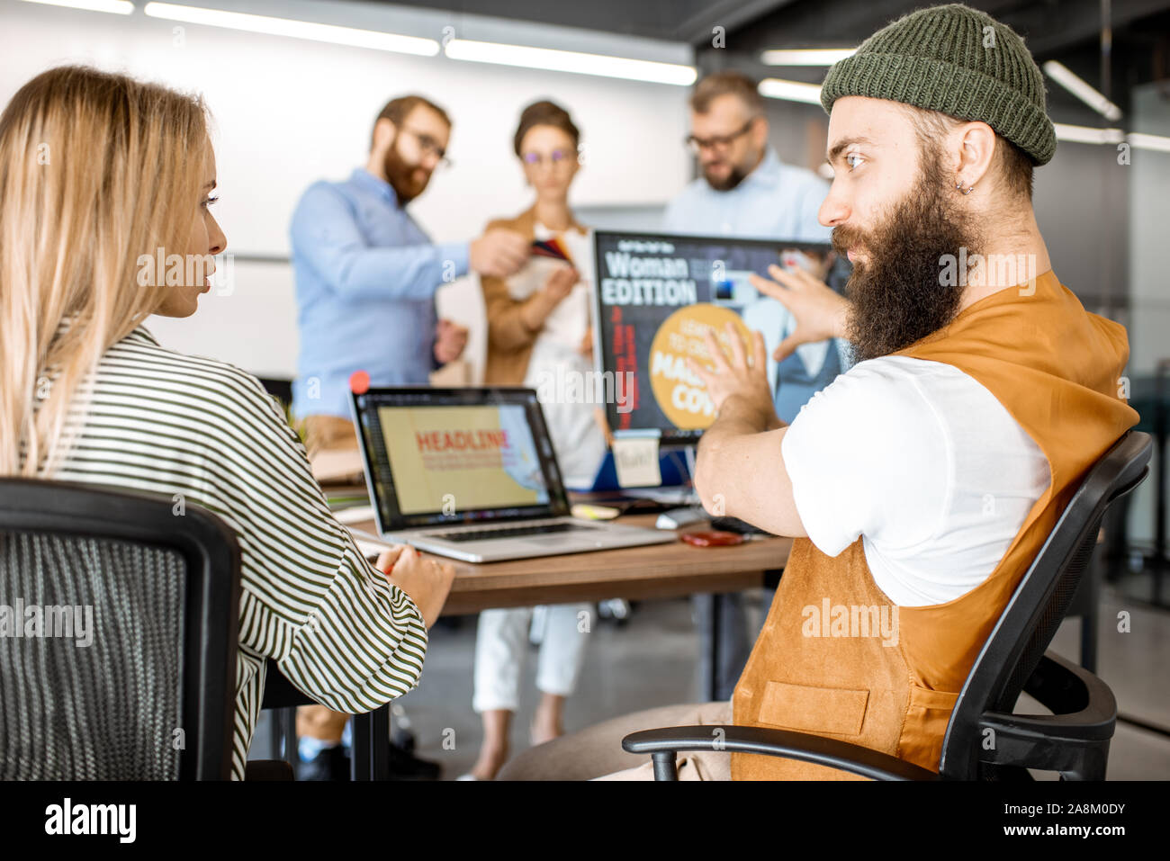 Group of diverse creative people working as a web designers in the ...