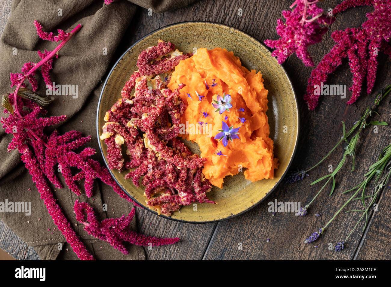 Fried Amaranthus caudatus flowers and sweet potato puree, decorated ...