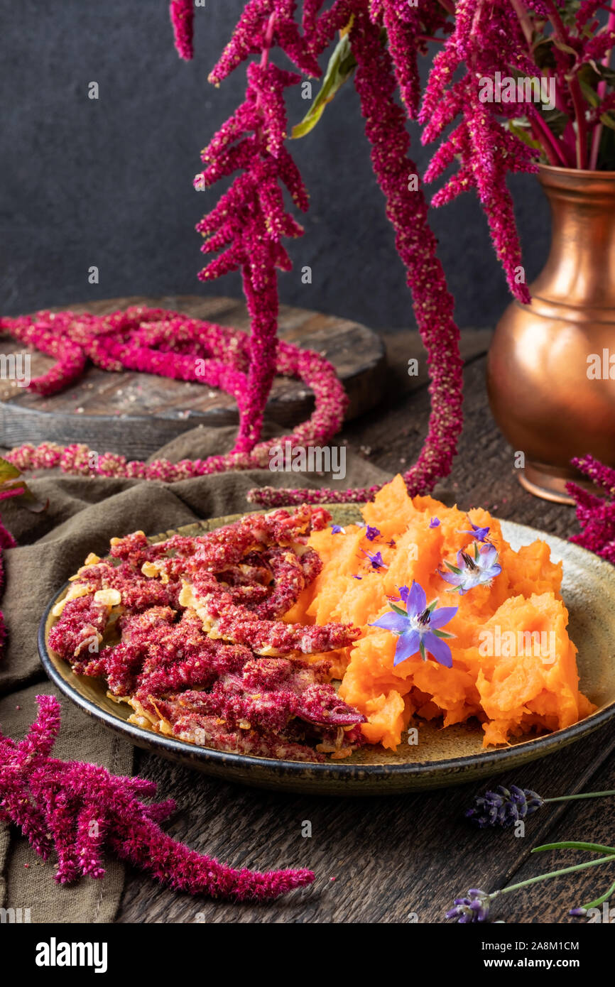 Fried Amaranthus caudatus flowers with sweet potato puree, decorated ...