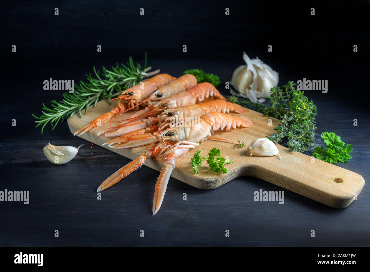 Fresh scampi, also called Norway Lobster or langoustine on a kitchen ...