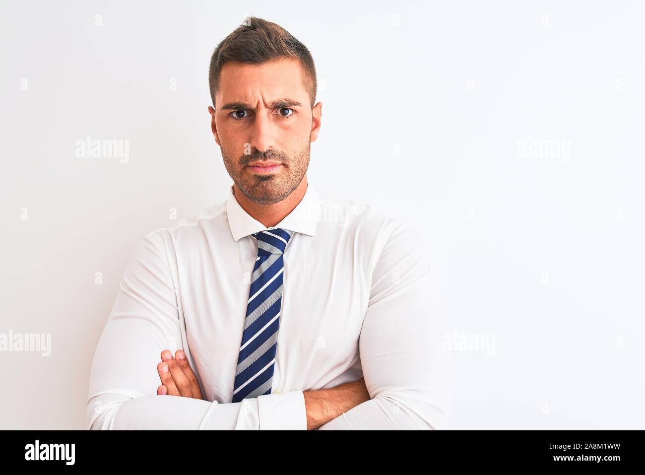 Young handsome elegant business man over isolated background skeptic ...