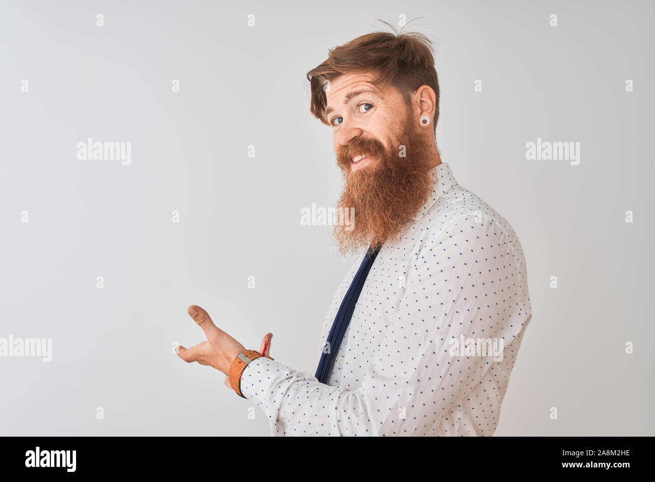Young redhead irish businessman standing over isolated white background ...