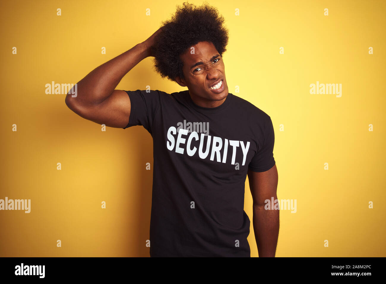American safeguard man with afro hair wearing security uniform over ...