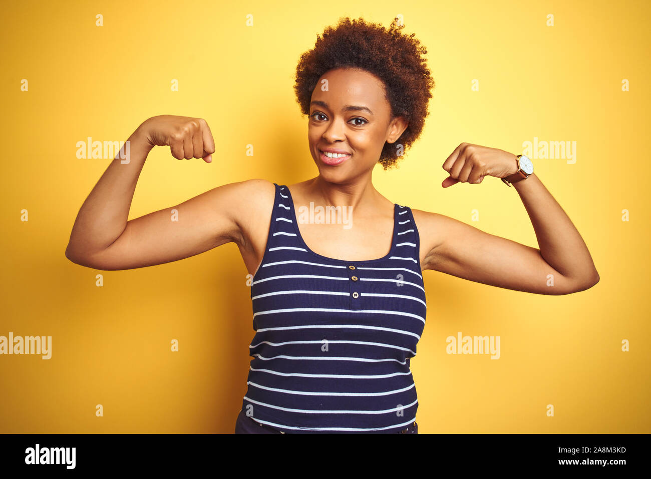 Beauitul african american woman wearing summer t-shirt over isolated ...