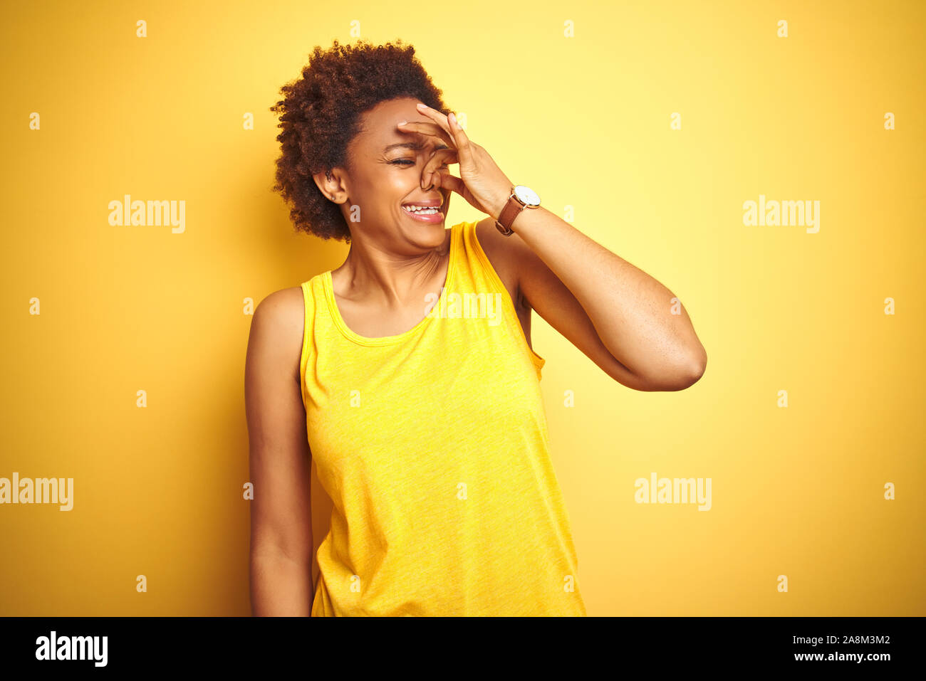 Beauitul african american woman wearing summer t-shirt over isolated ...