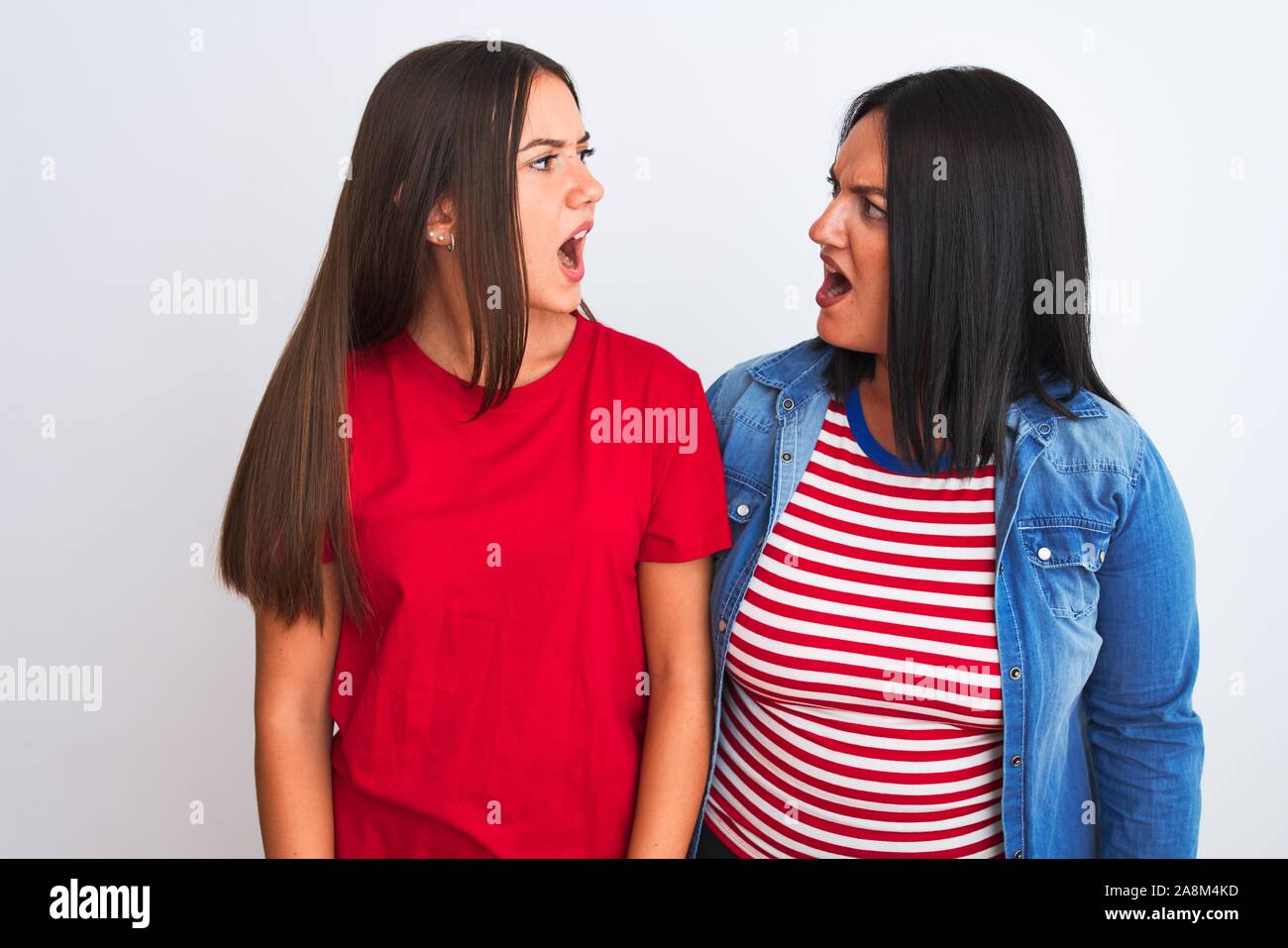 Young beautiful women wearing casual clothes standing over isolated ...
