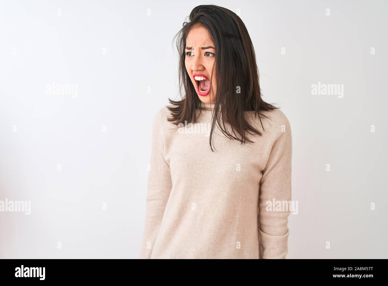 Beautiful chinese woman wearing turtleneck sweater standing over ...