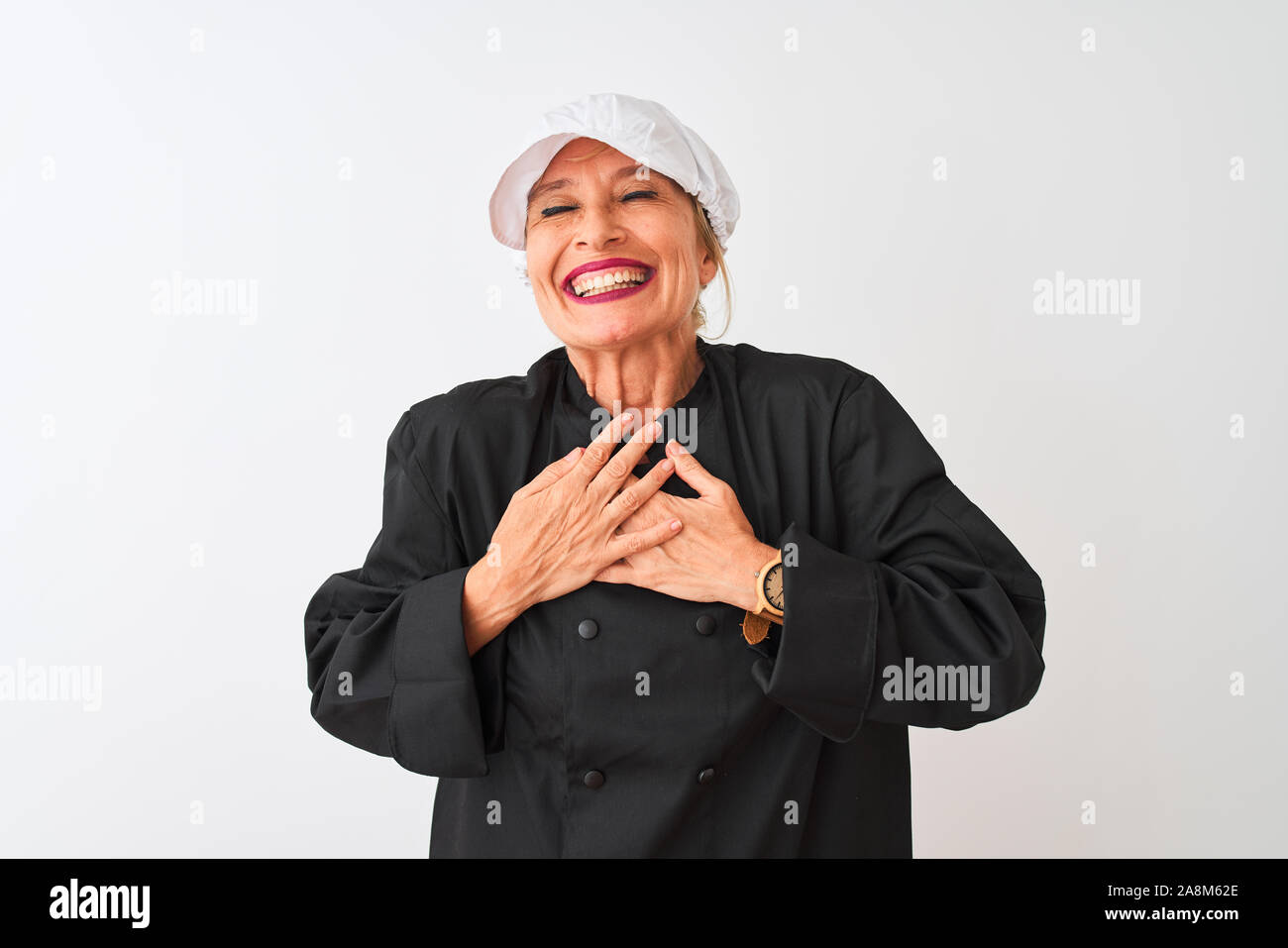 Middle age chef woman wearing uniform and cap standing over isolated ...
