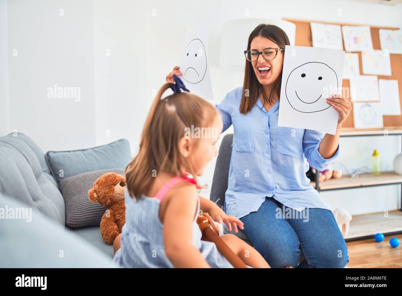 Young therapist woman speaking and treating child, counselor and ...