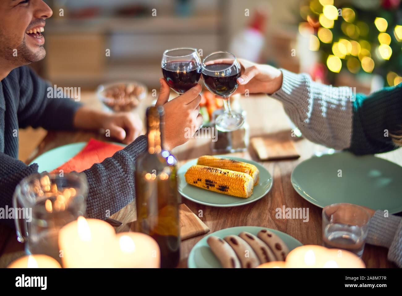 Young beautiful couple smiling happy and confident. Eating food and ...