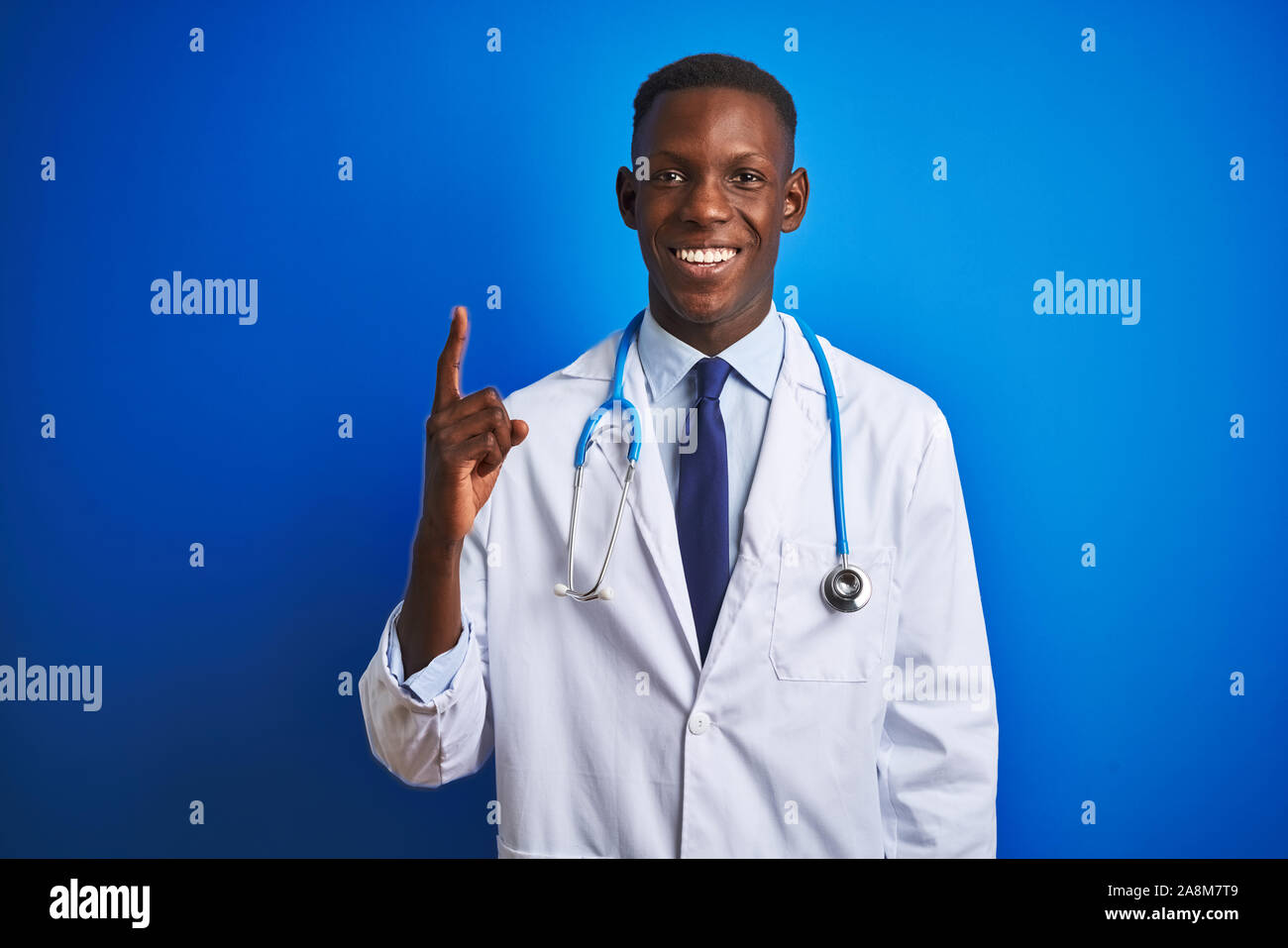 African american doctor man wearing stethoscope standing over isolated ...