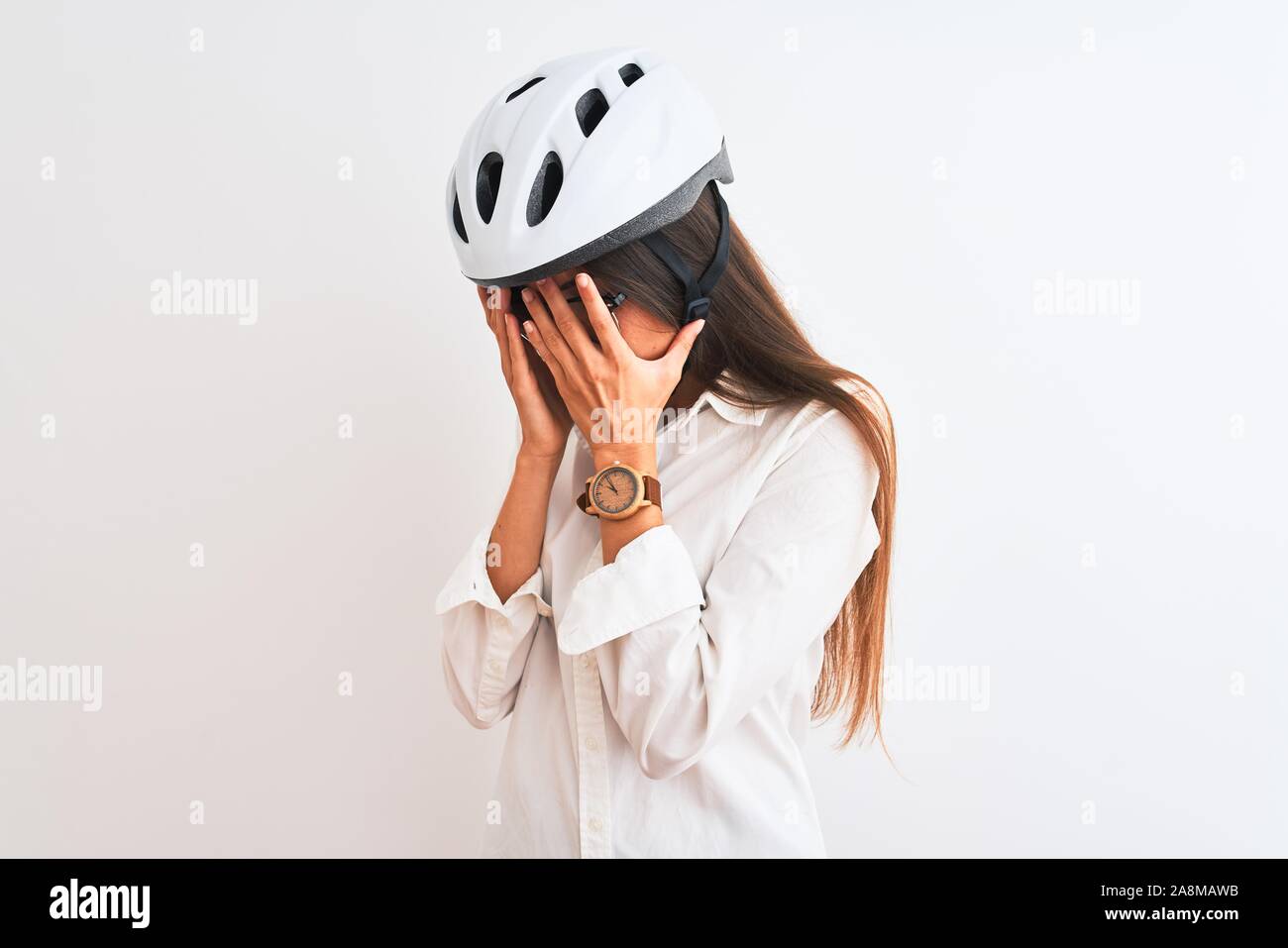 Beautiful businesswoman wearing glasses and bike helmet over isolated ...