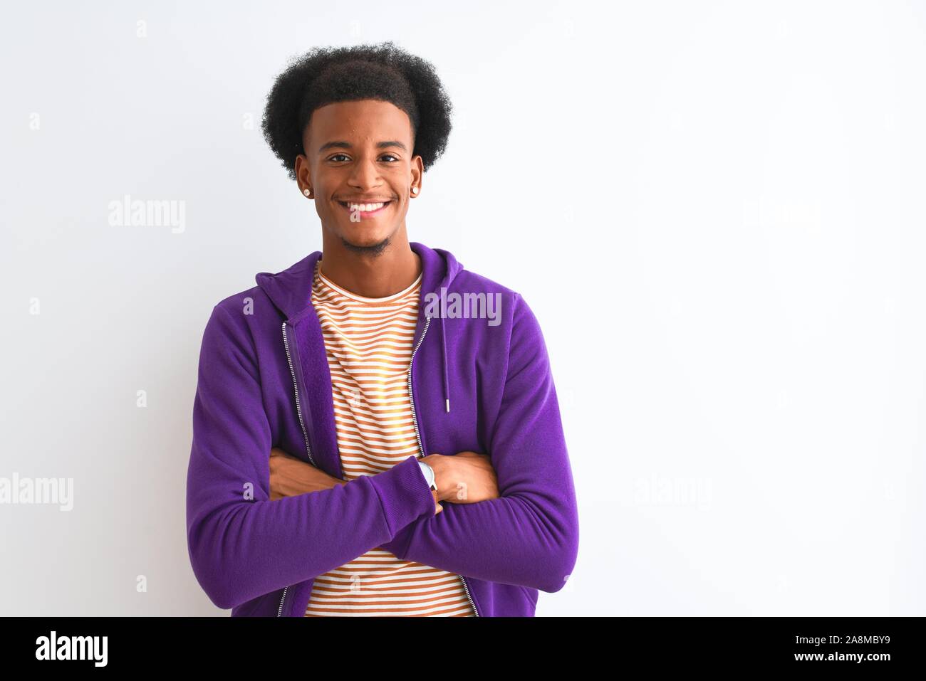 African american man wearing purple sweatshirt standing over isolated ...