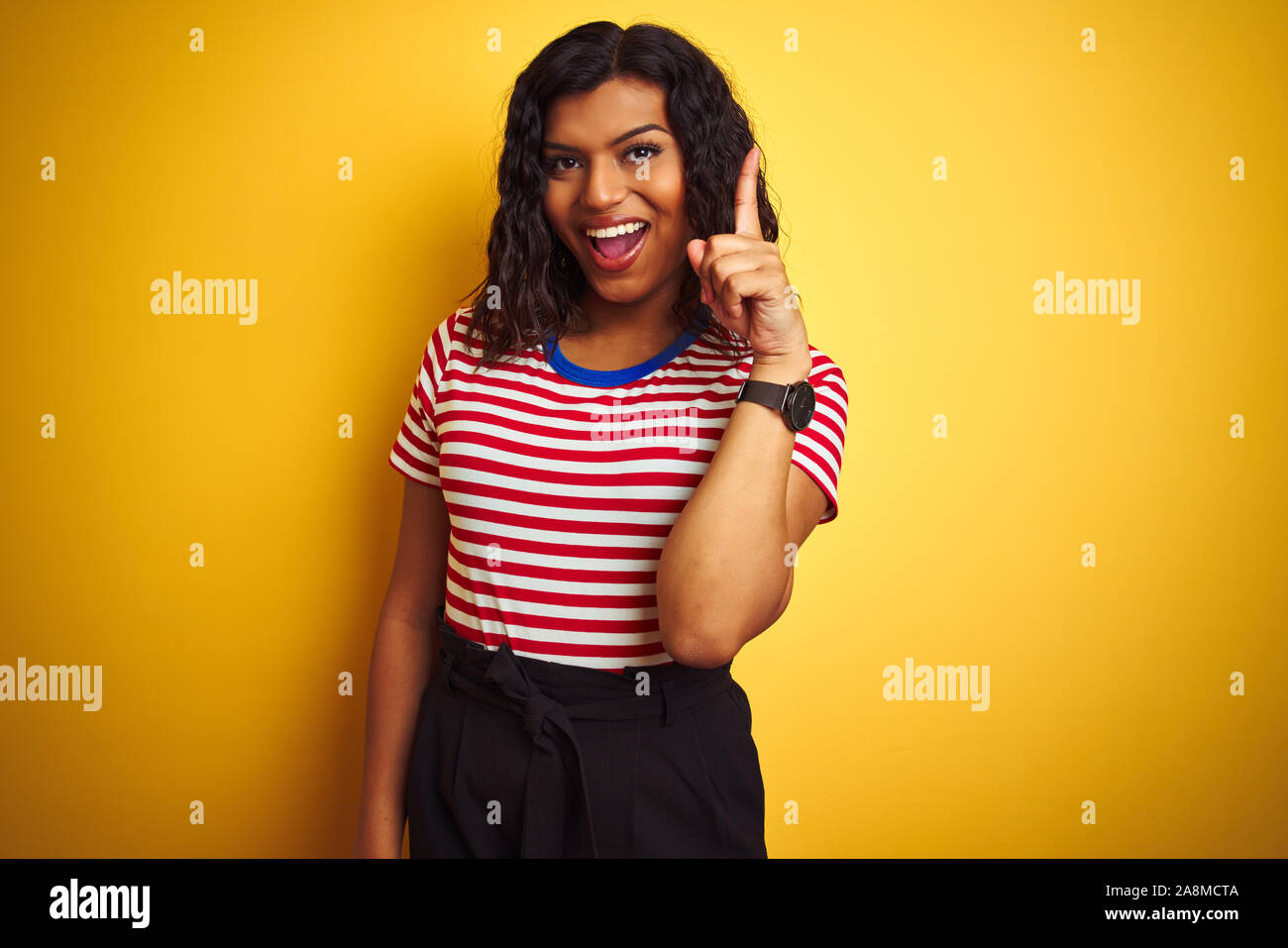 Transsexual transgender woman wearing stiped t-shirt over isolated ...