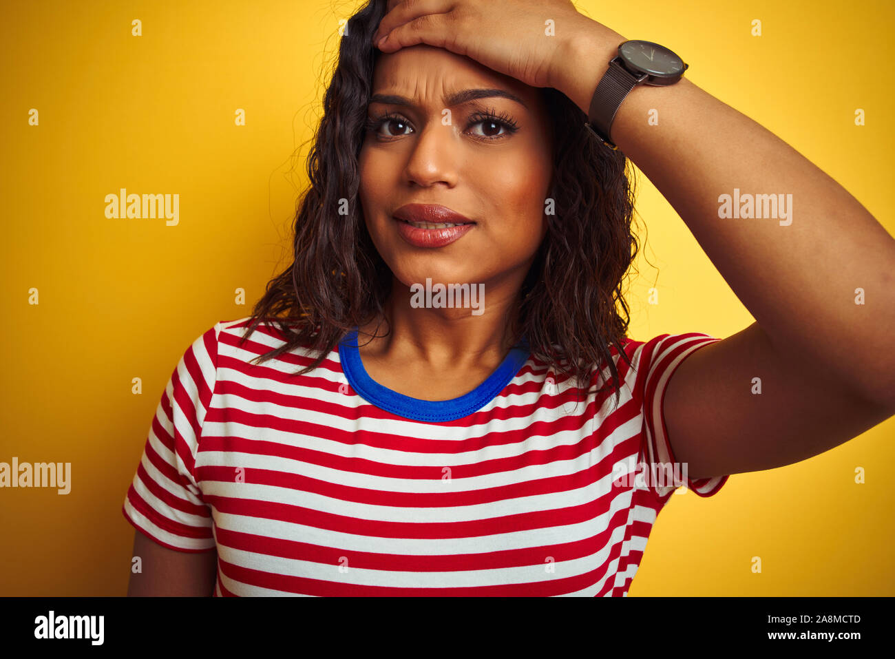 Transsexual transgender woman wearing stiped t-shirt over isolated ...