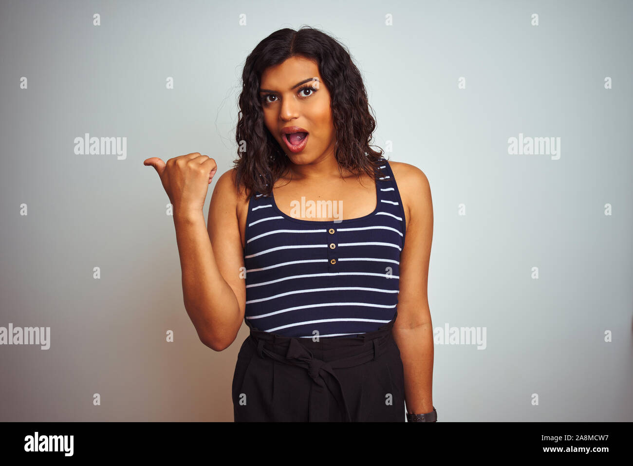 Transsexual transgender woman wearing striped t-shirt over isolated ...