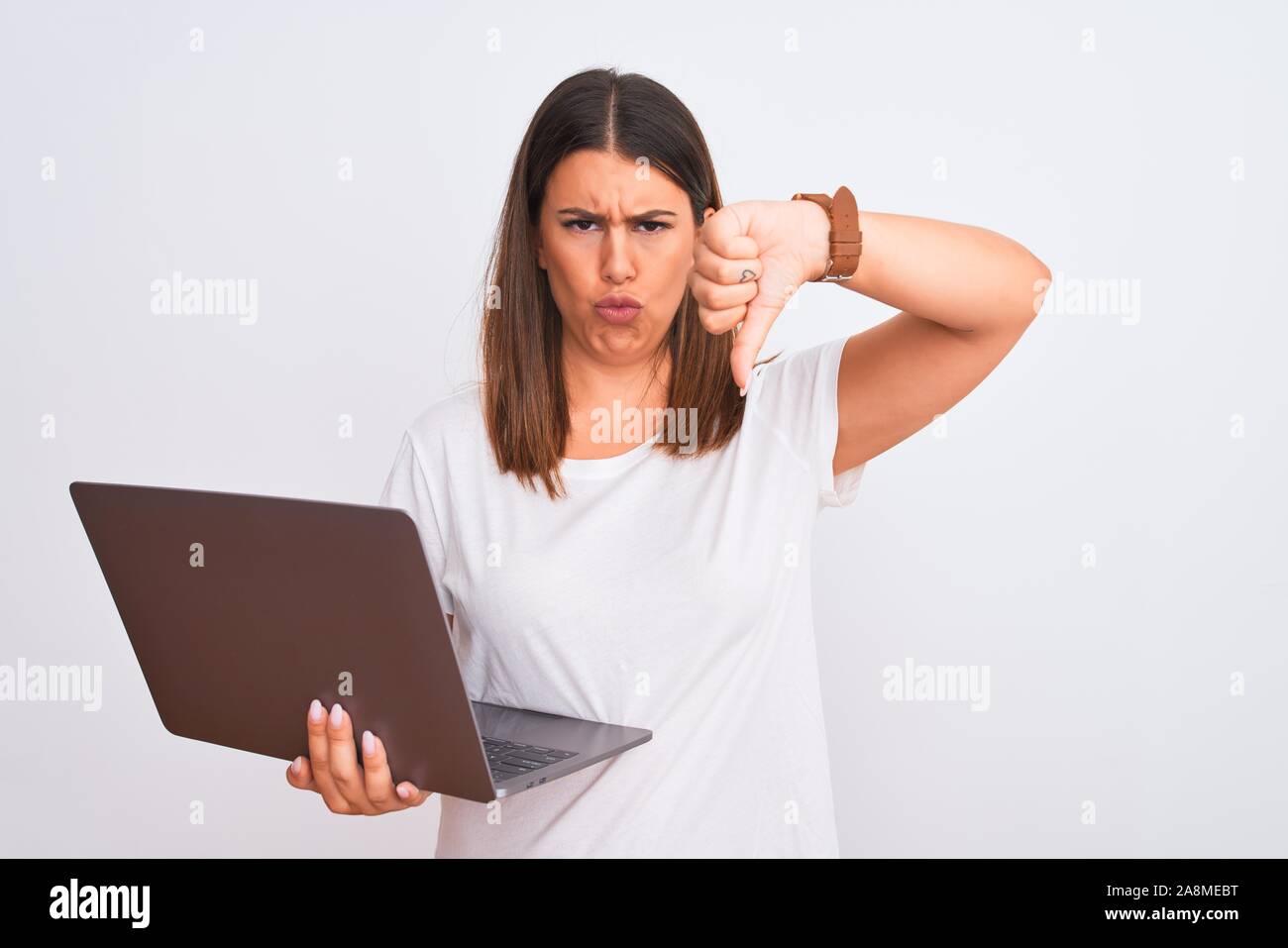 Beautiful young woman working using computer laptop over white ...