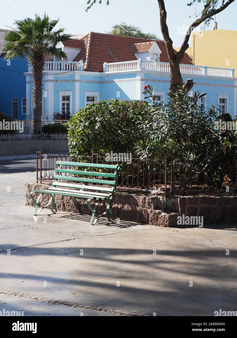 Colorful buildings at main square with exotic plants in african Mindelo ...