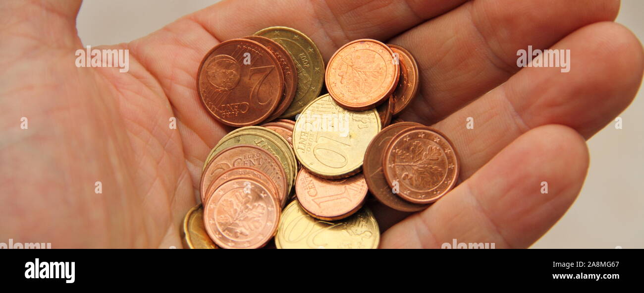 a handful of small money Stock Photo - Alamy