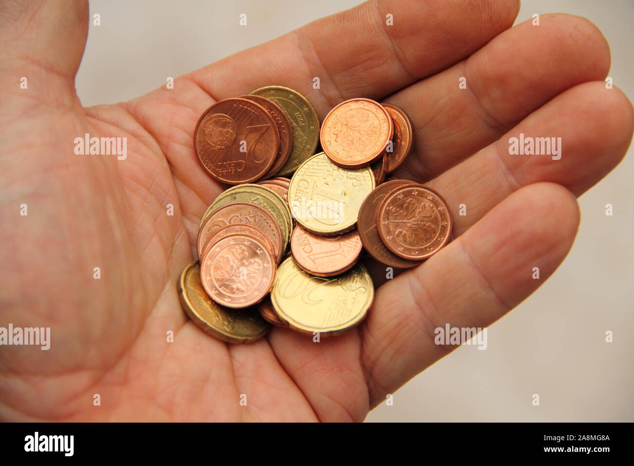 Handful loose change hi-res stock photography and images - Alamy