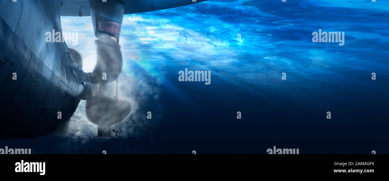 Propeller and rudder of big ship underway from underwater. Close up ...