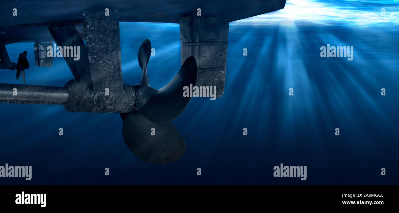 Twin propeller and rudder of big ship underway from underwater. Close ...