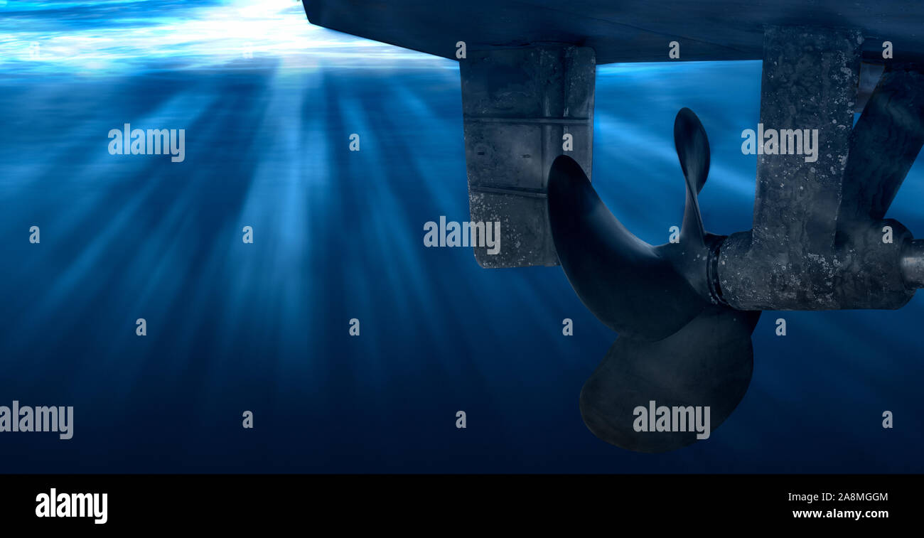 Propeller and rudder of big ship underway from underwater. Close up ...