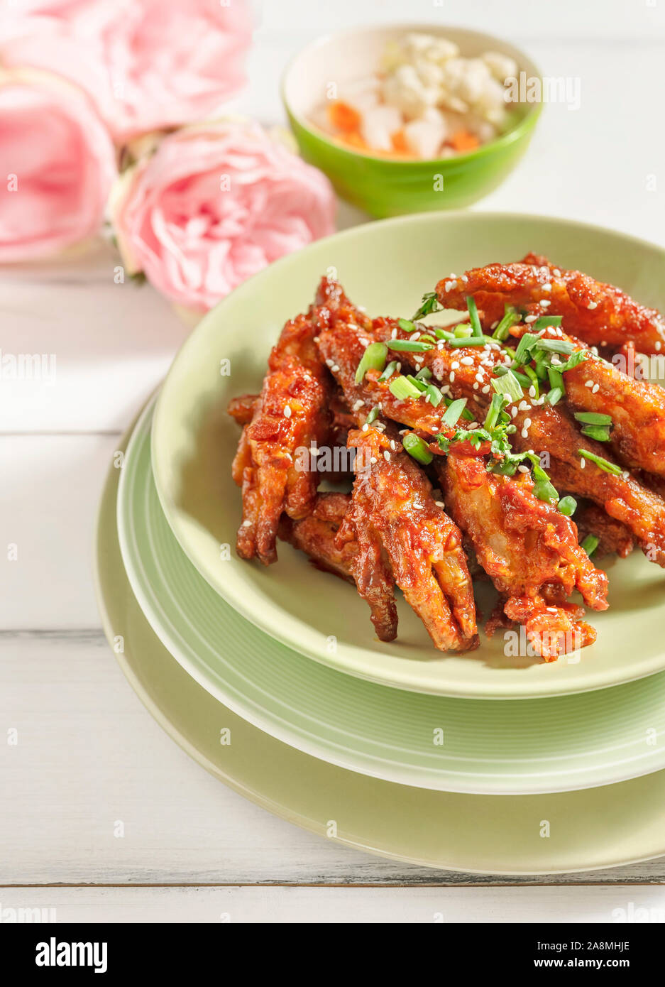 Crispy fried spicy chicken feet served with pickled vegetables Stock ...