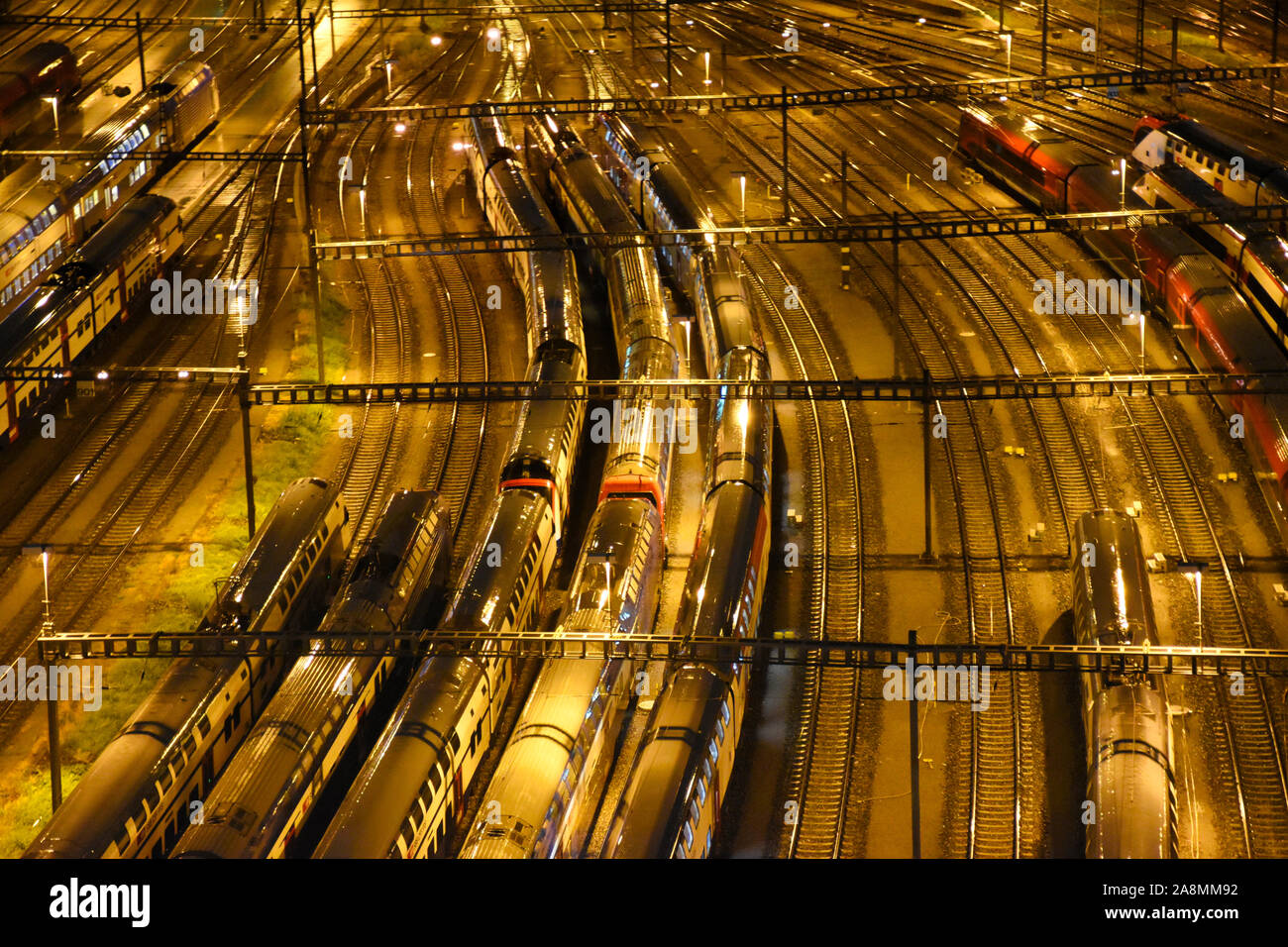 Aerial view of freight, cargo and passenger trains waiting at the train ...