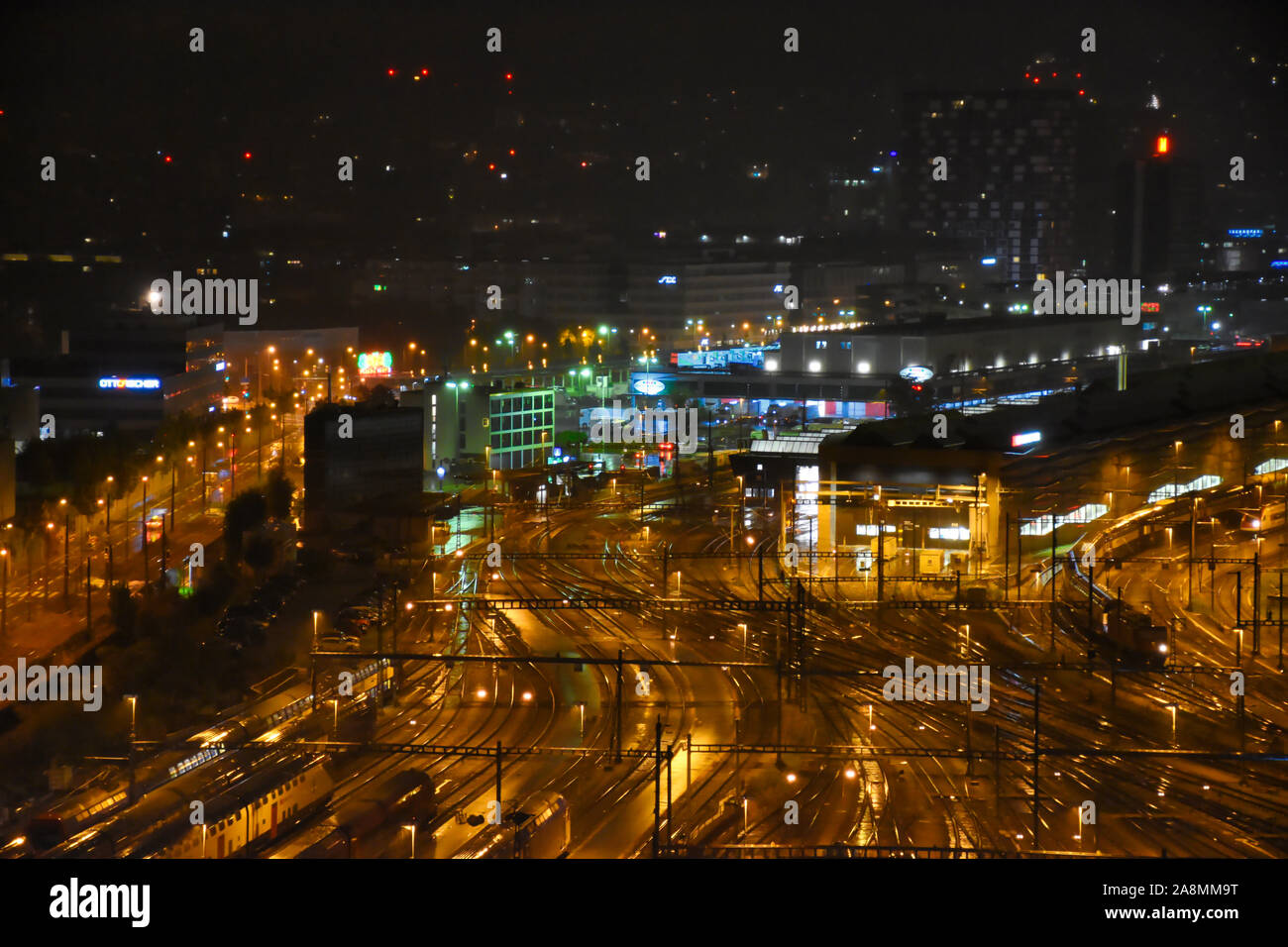 Aerial view of freight, cargo and passenger trains waiting at the train ...